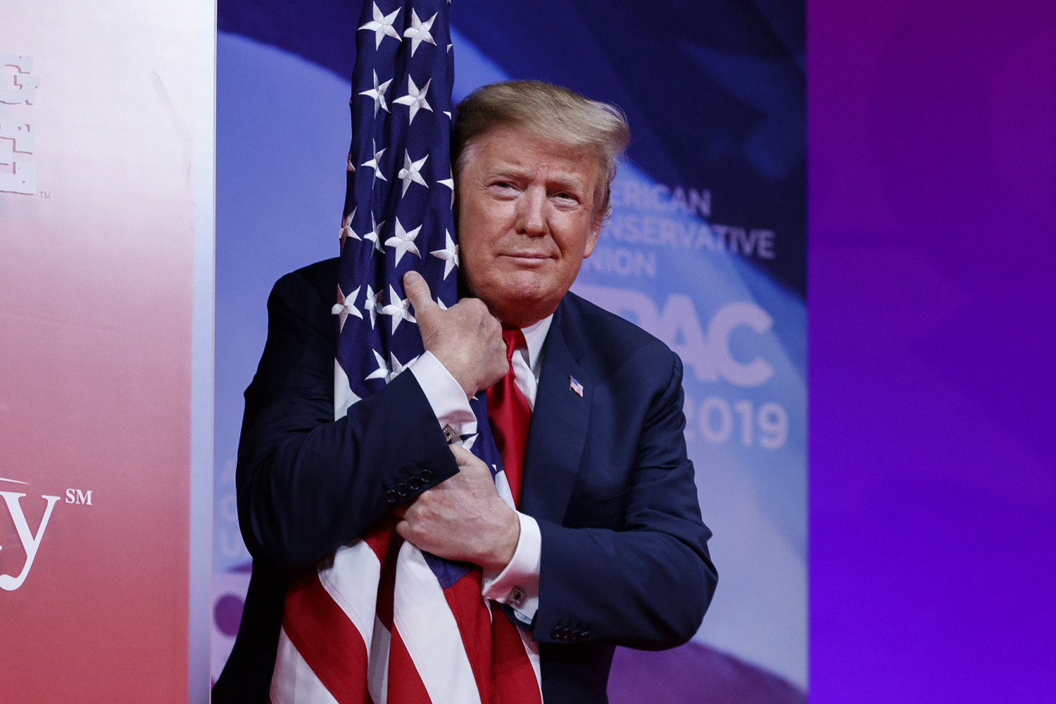 President Trump Hugs American Flag at Conservative Conference